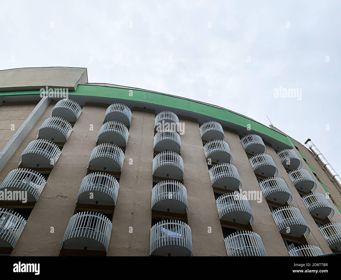 Low angle shot of rows of round balconies on a building Stock Photo - Alamy