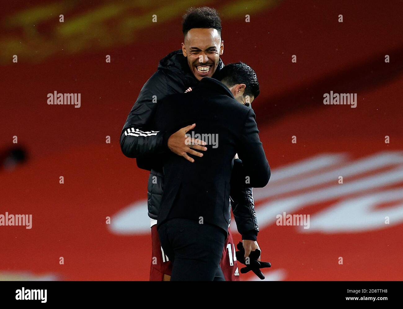 Arsenal manager Mikel Arteta (left) and Pierre-Emerick Aubameyang celebrate after the final ...