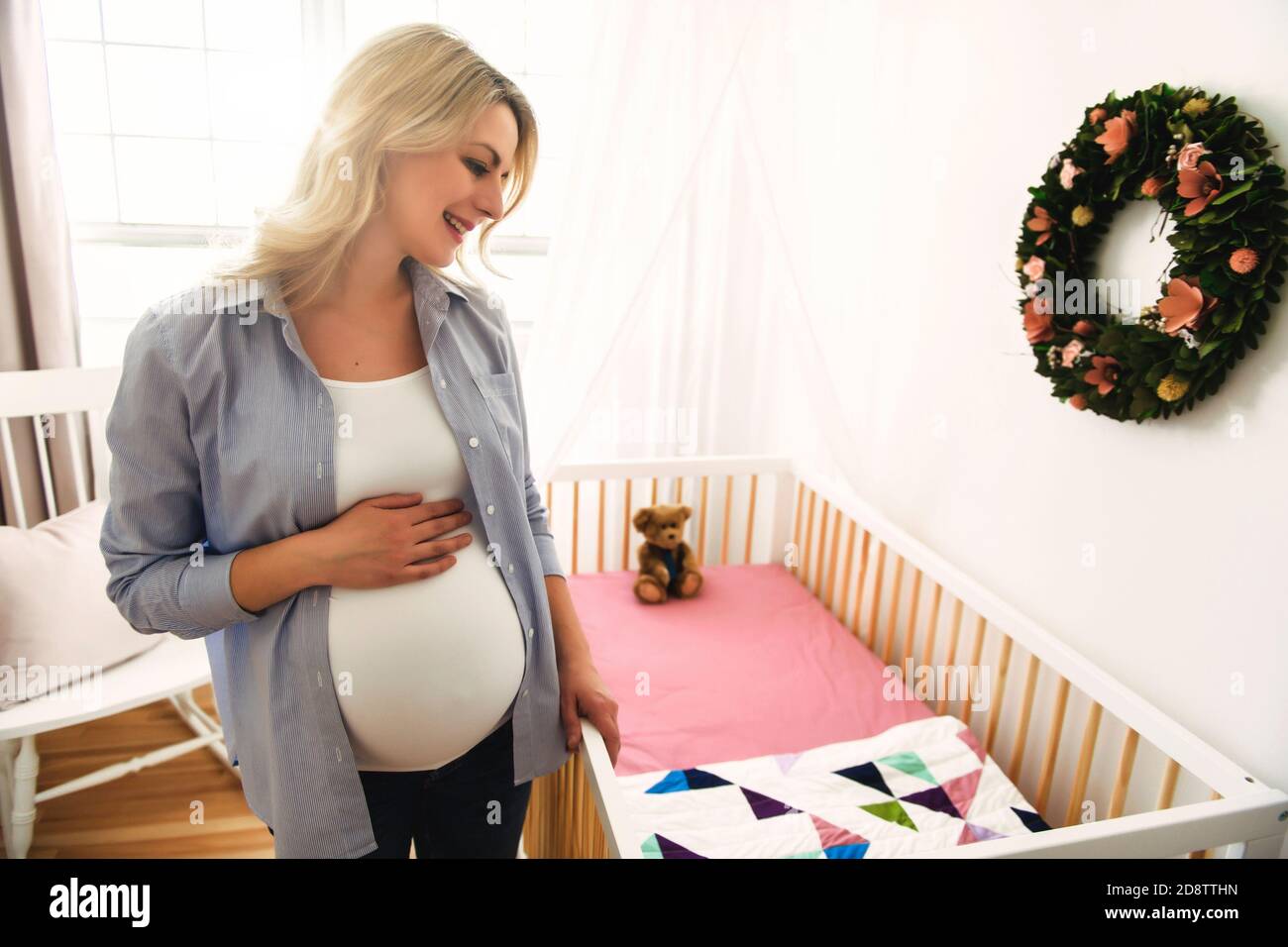 Young and happy pregnant woman expecting a baby Stock Photo - Alamy