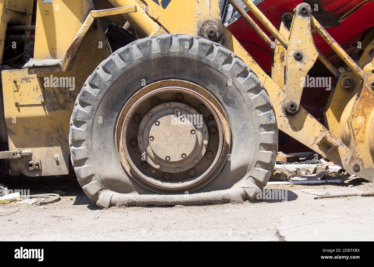 Heavy equipment flat tire Stock Photo - Alamy