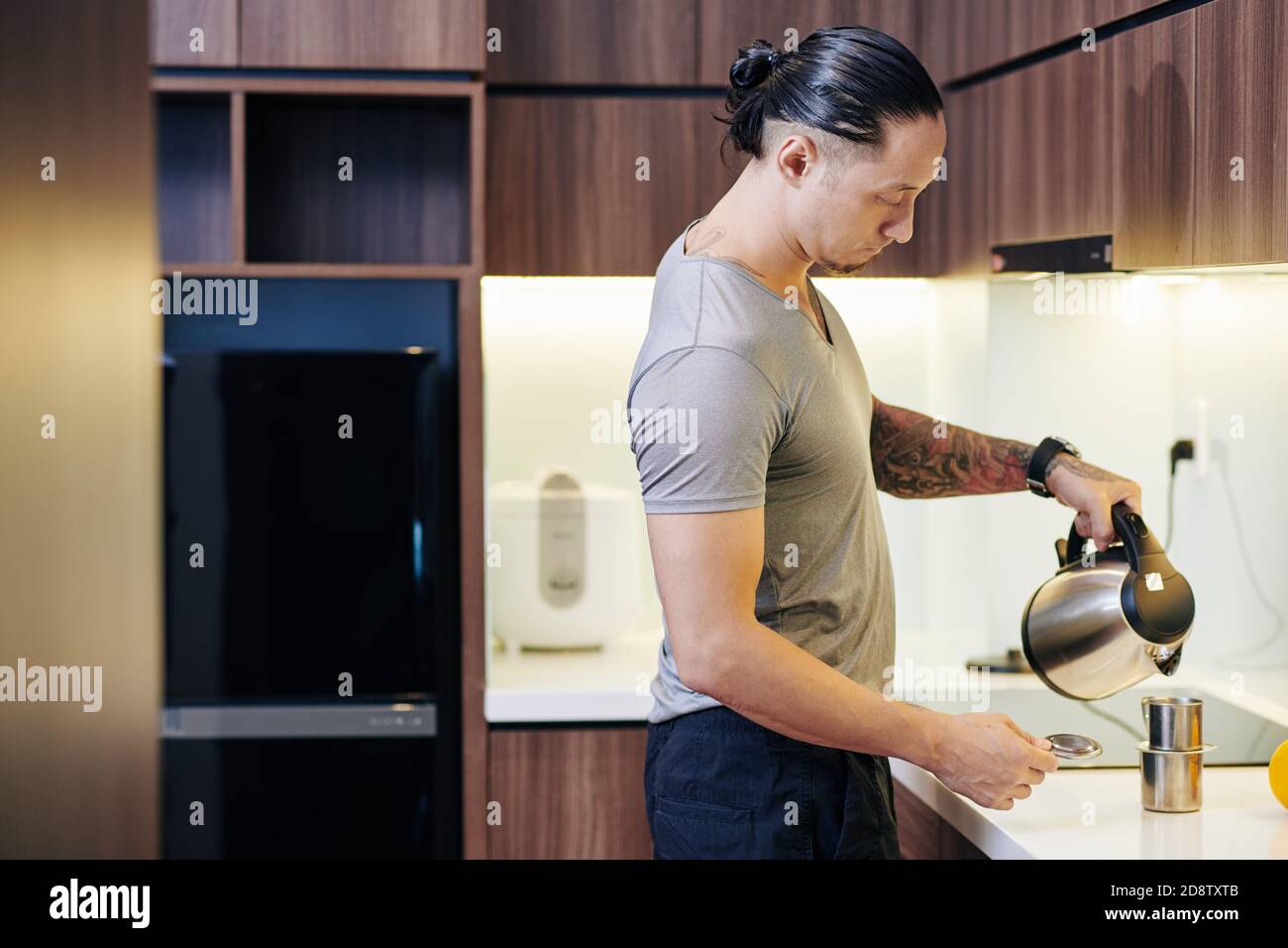 Man brewing morning coffee Stock Photo - Alamy