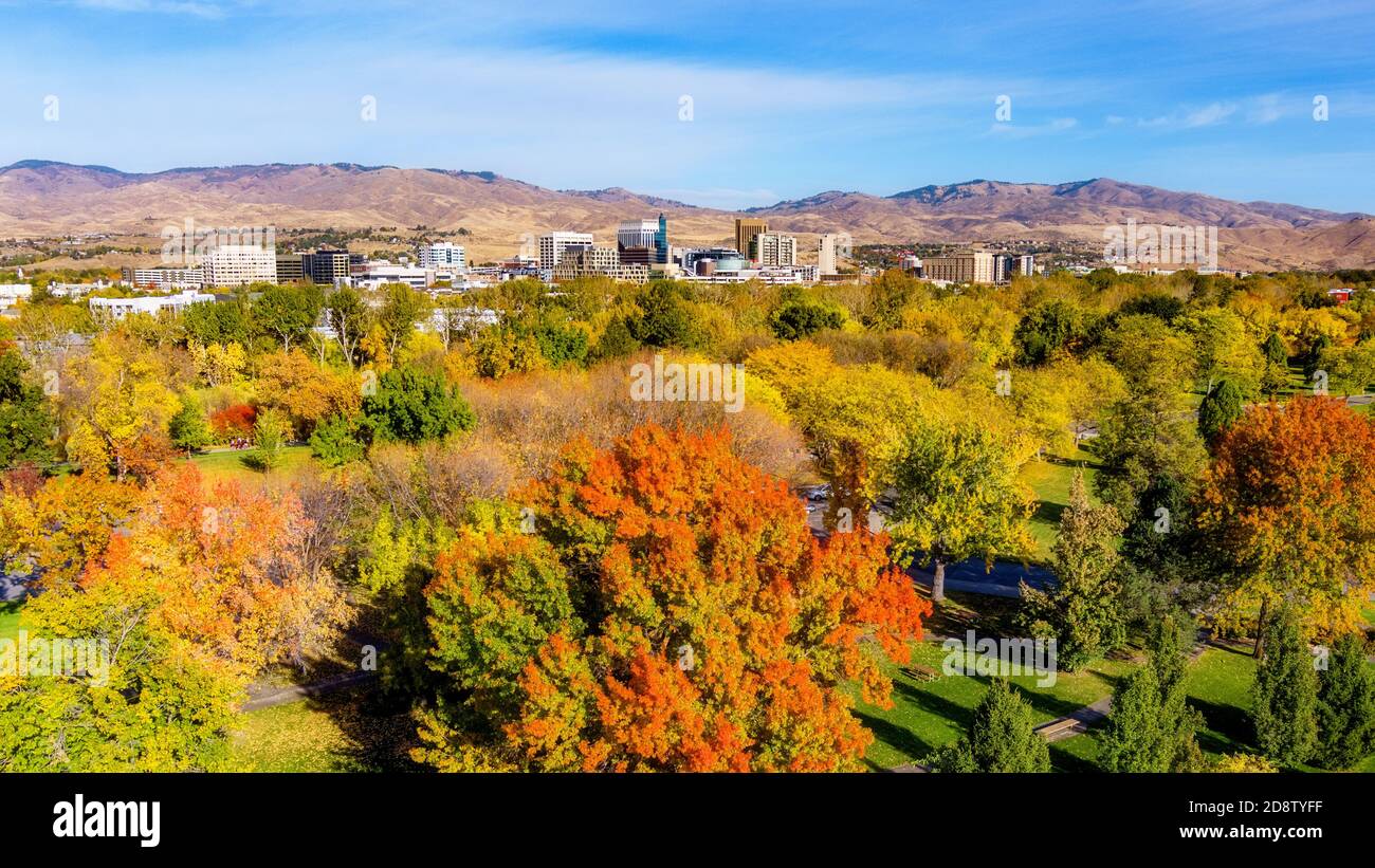 Fall trees fill a city park with the Boise Idaho skyline Stock Photo ...
