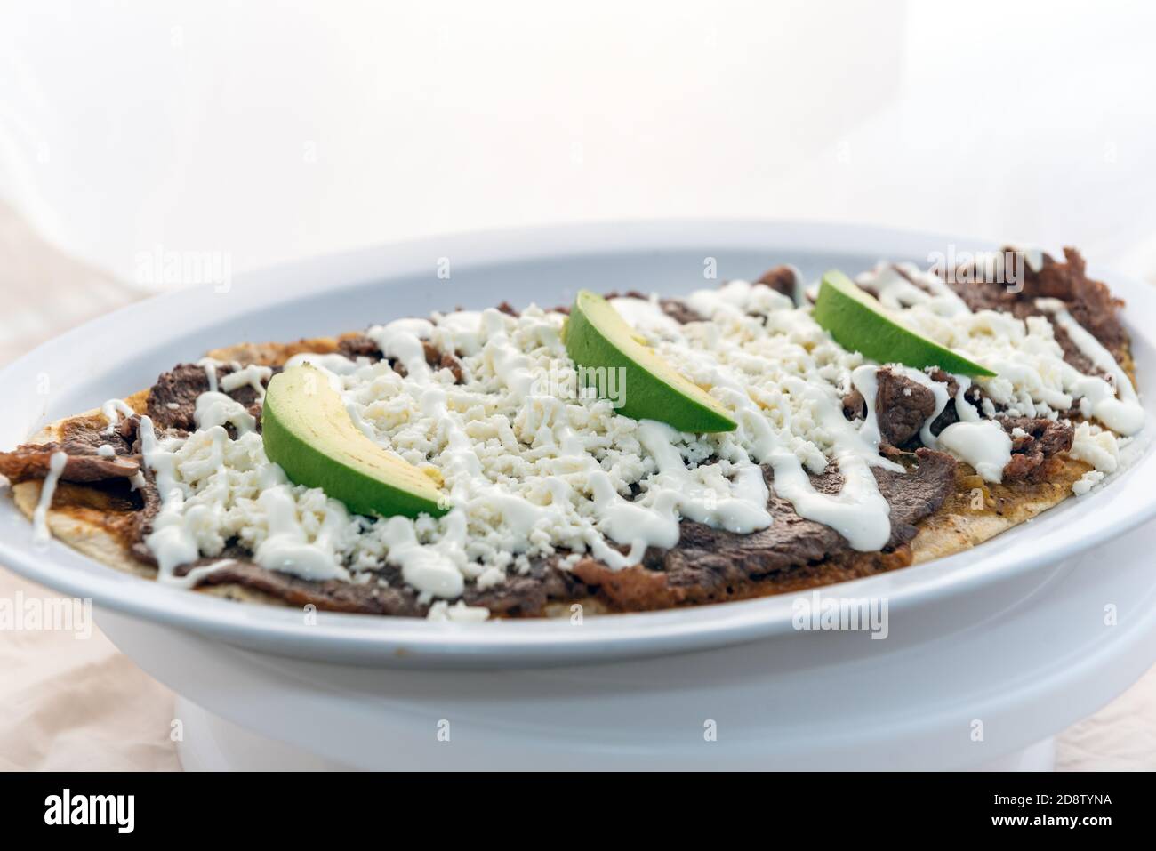 Huarache served on a plate looks and tastes appealing Stock Photo - Alamy