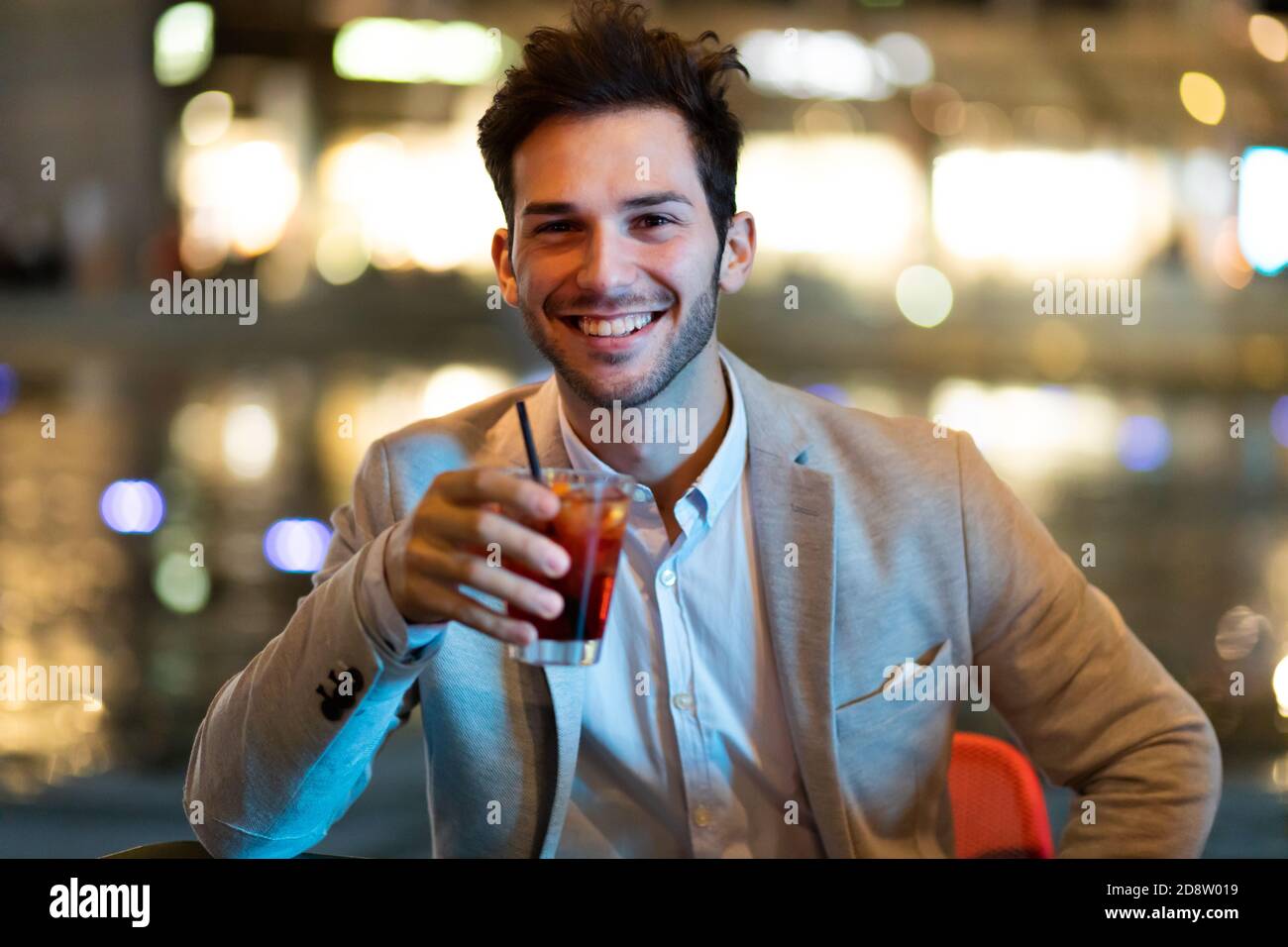 Man holding drink club hi-res stock photography and images - Alamy Man holding drink club hi-res stock photography and images - Alamy