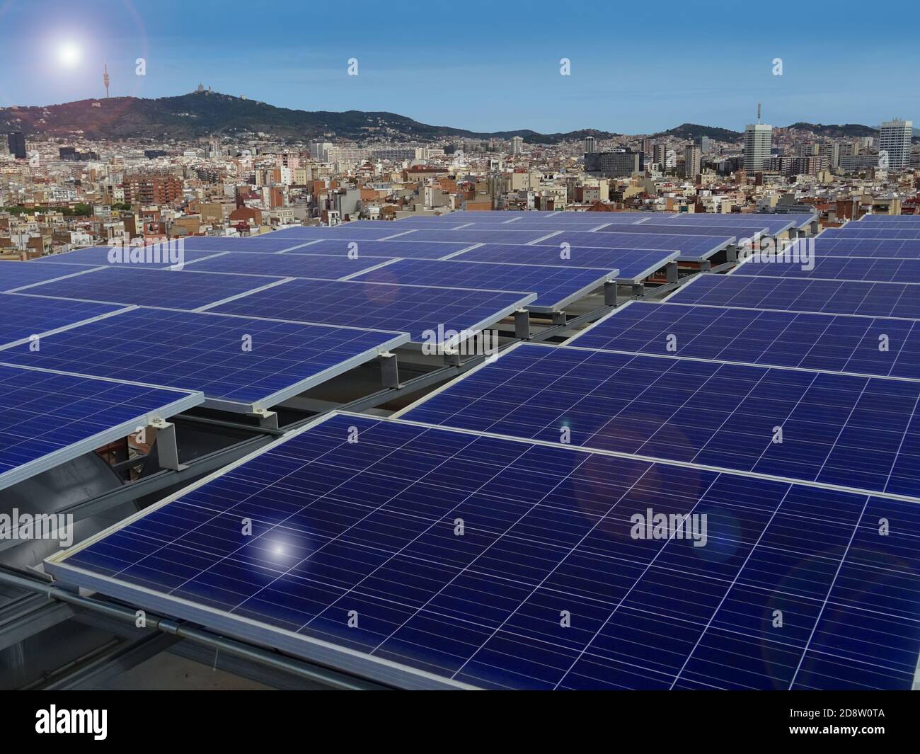 Diagonal view of solar panels on a rooftop with a view city skyline on ...