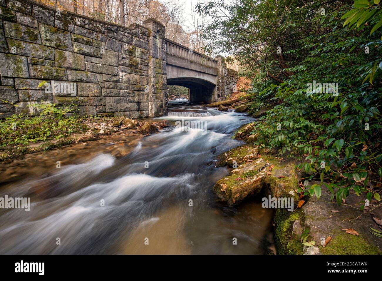 Cascade flowing under stone bridge in Pisgah National Forest - near ...