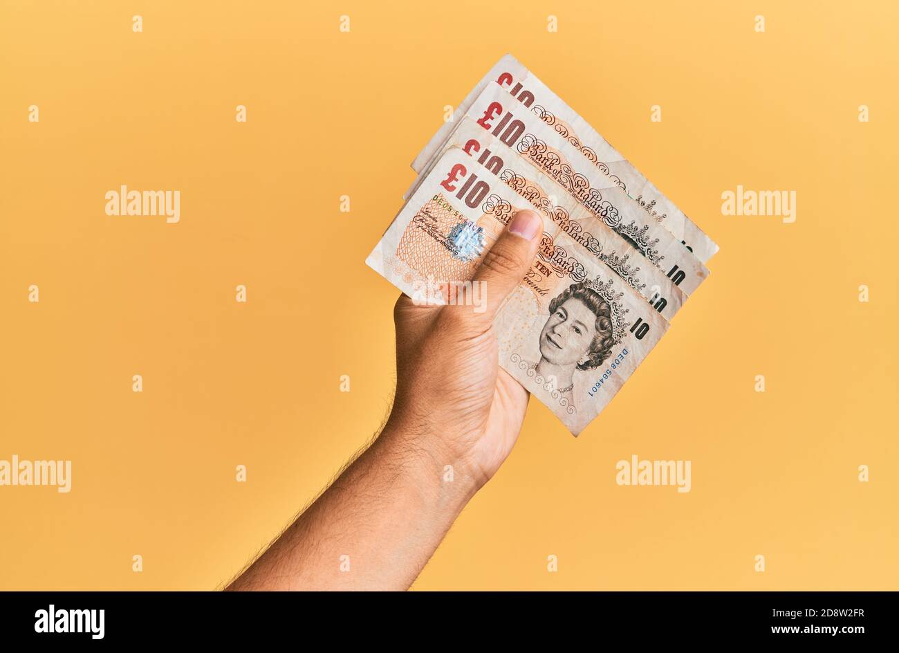 Hand holding uk cash isolated hi-res stock photography and images - Alamy