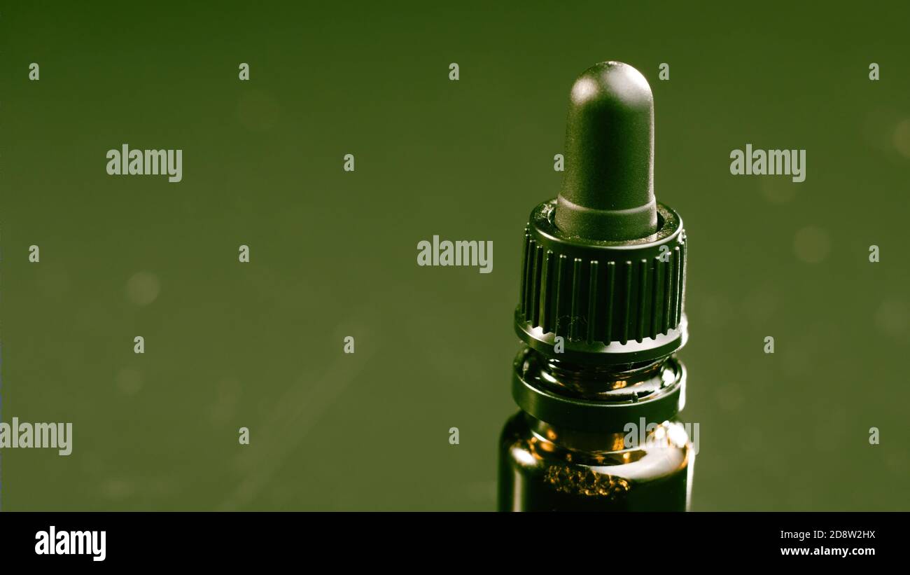 CBD Hemp oil in a bottle with pipette droplet. Cannabis extract for ...