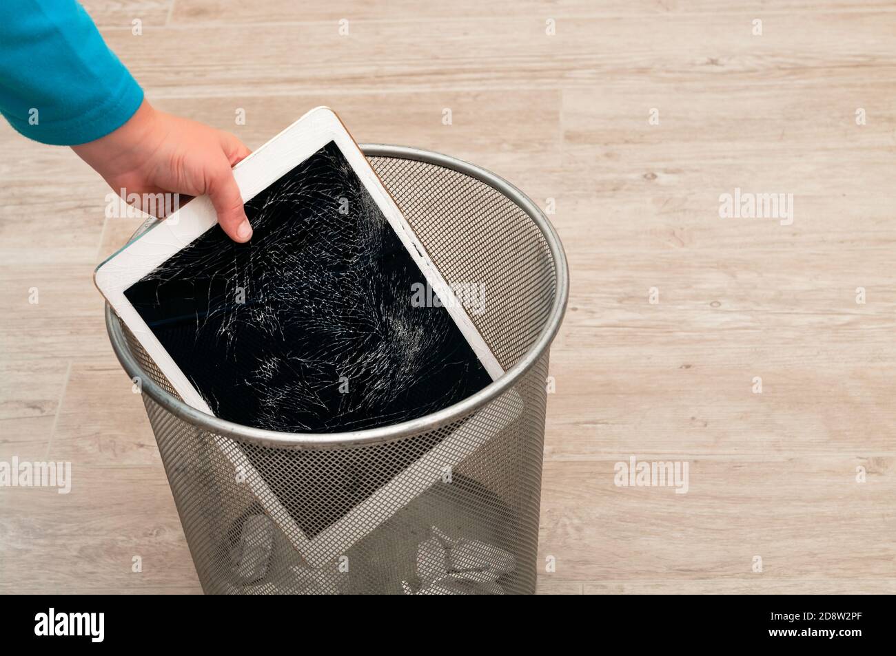 Boy throws it in the trash modern tablet with highly broken screen ...