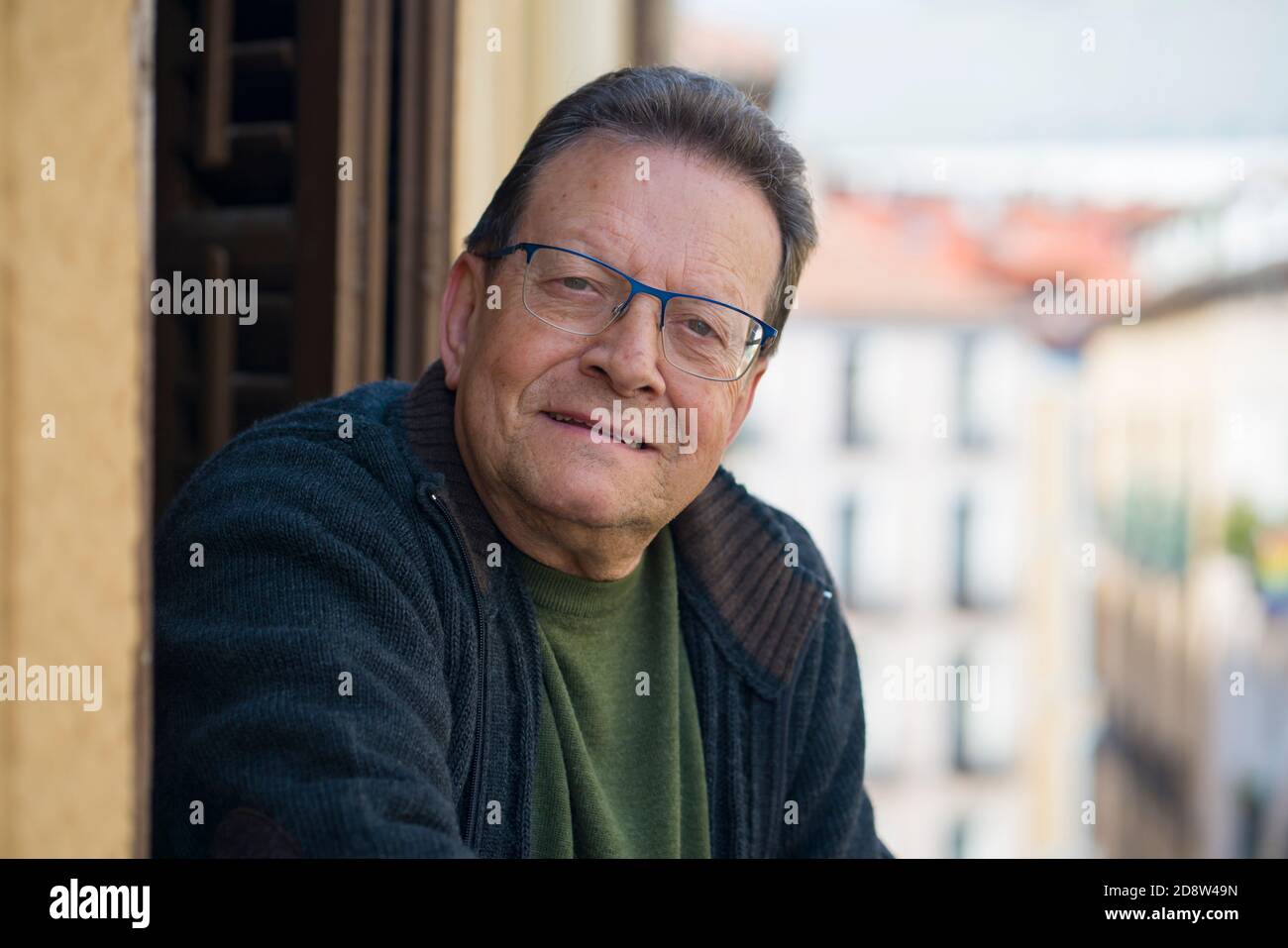 lifestyle portrait of happy and cheerful mature man 65 to 70 years old ...