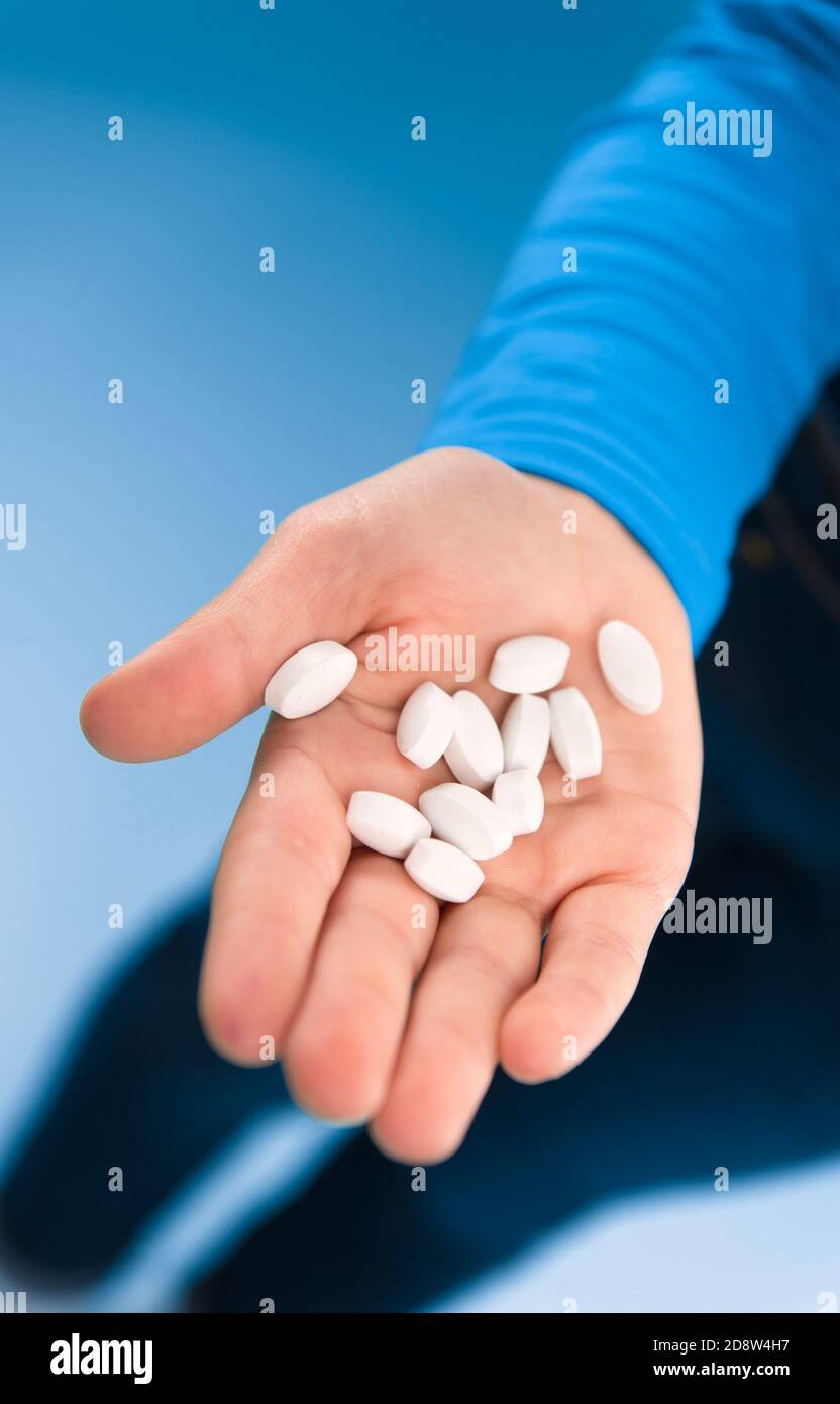 Take your pills. Pills on human hand. Prescribed and dispensed pills ...