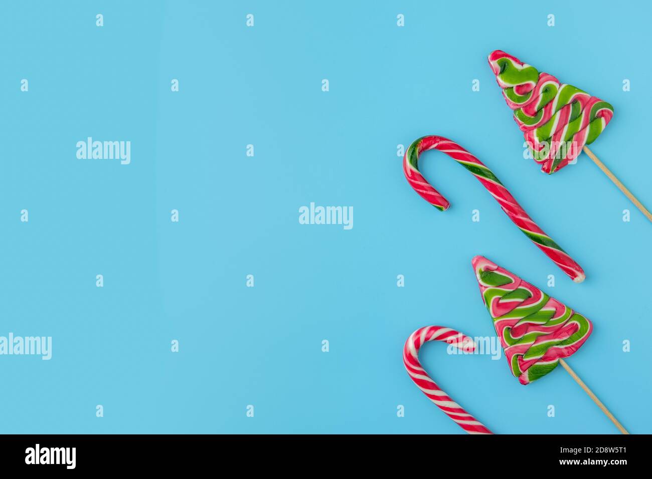 Christmas candies on blue background. Candy shapes, candy cane. Flat ...