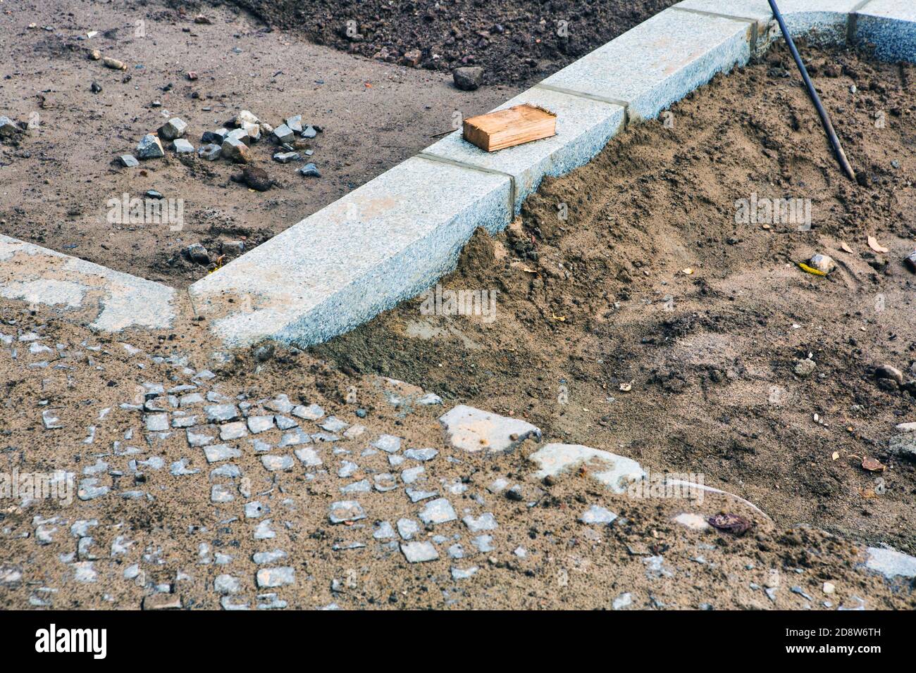 Close-up of a road construction site with cobblestones Stock Photo - Alamy