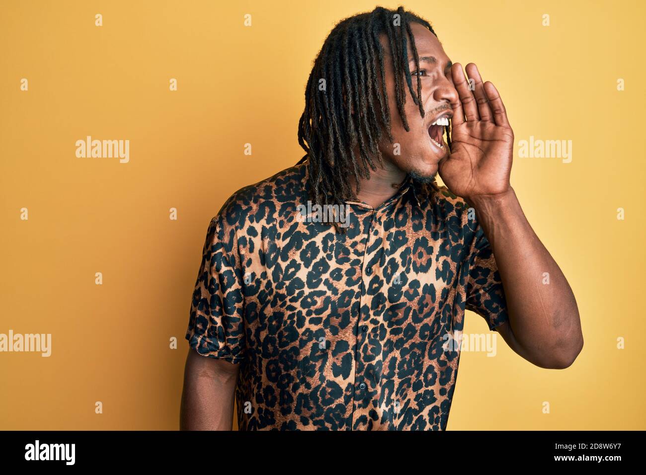 African american man with braids wearing leopard animal print shirt ...