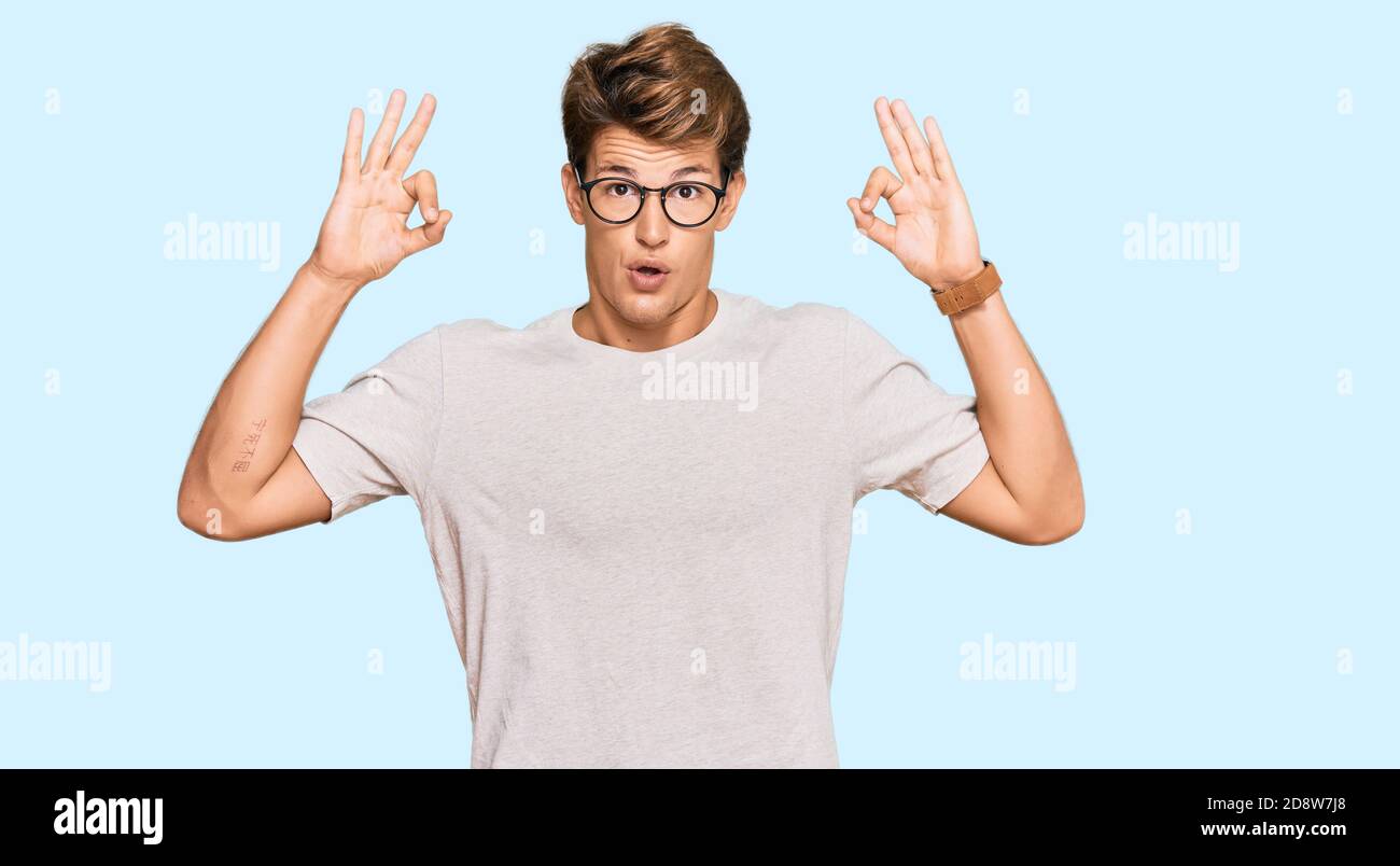 Handsome caucasian man wearing casual clothes and glasses looking ...