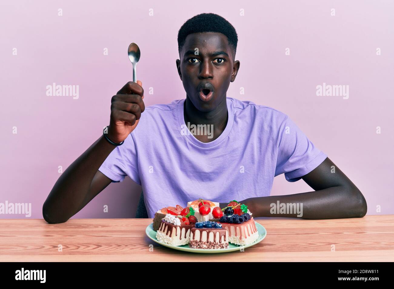 Boy eating cake african hi-res stock photography and images - Alamy