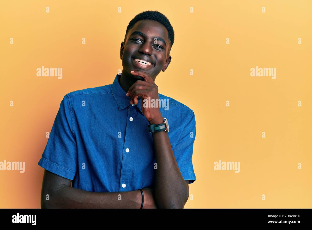 Young african american man wearing casual clothes smiling looking ...