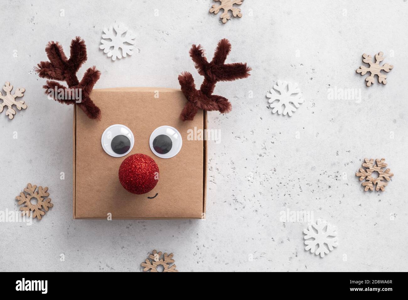 Christmas and New Year holiday concept. Deer gift box Stock Photo - Alamy