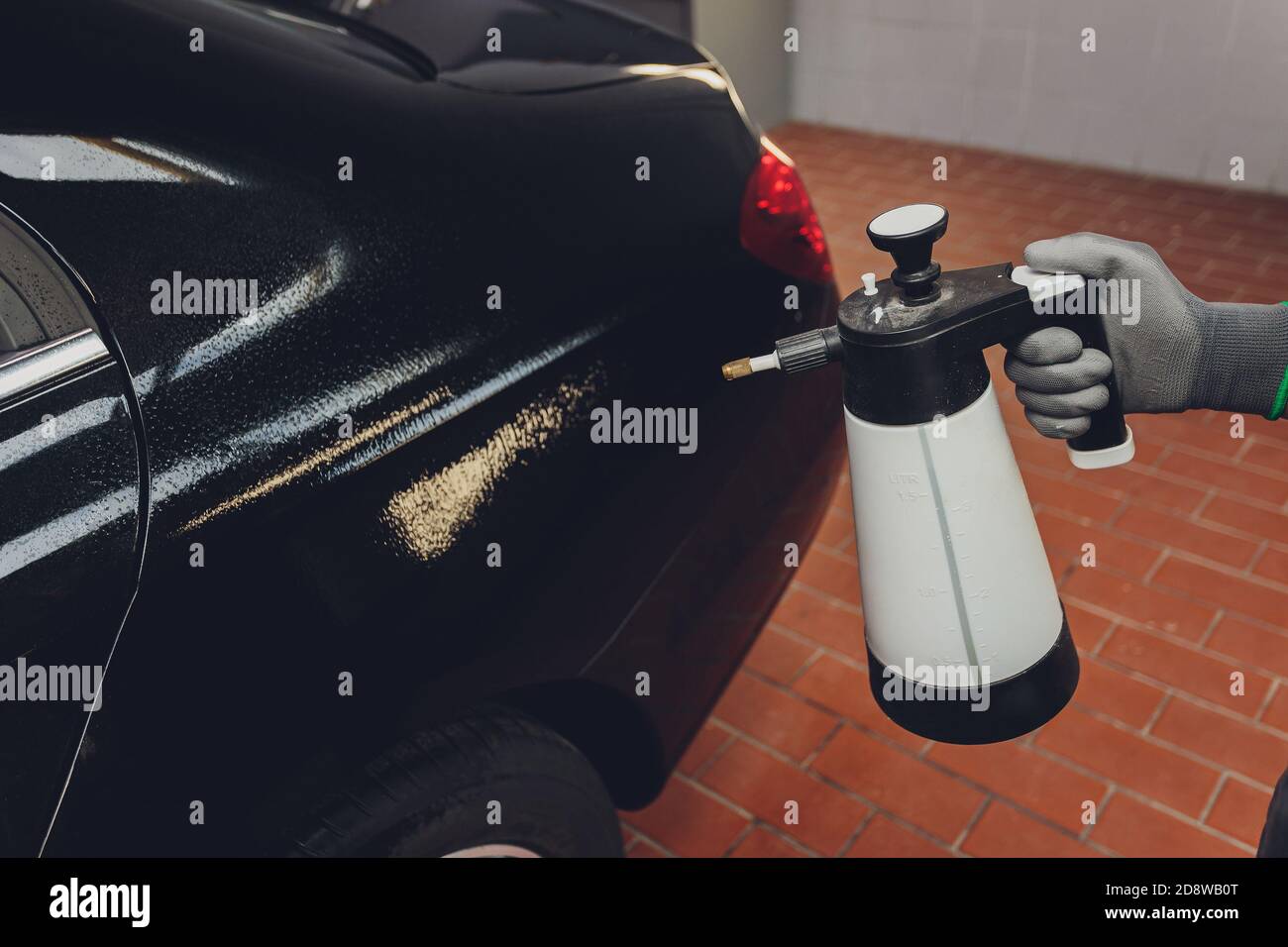 Man washing car using high water pressure, car detailing, preparation ...