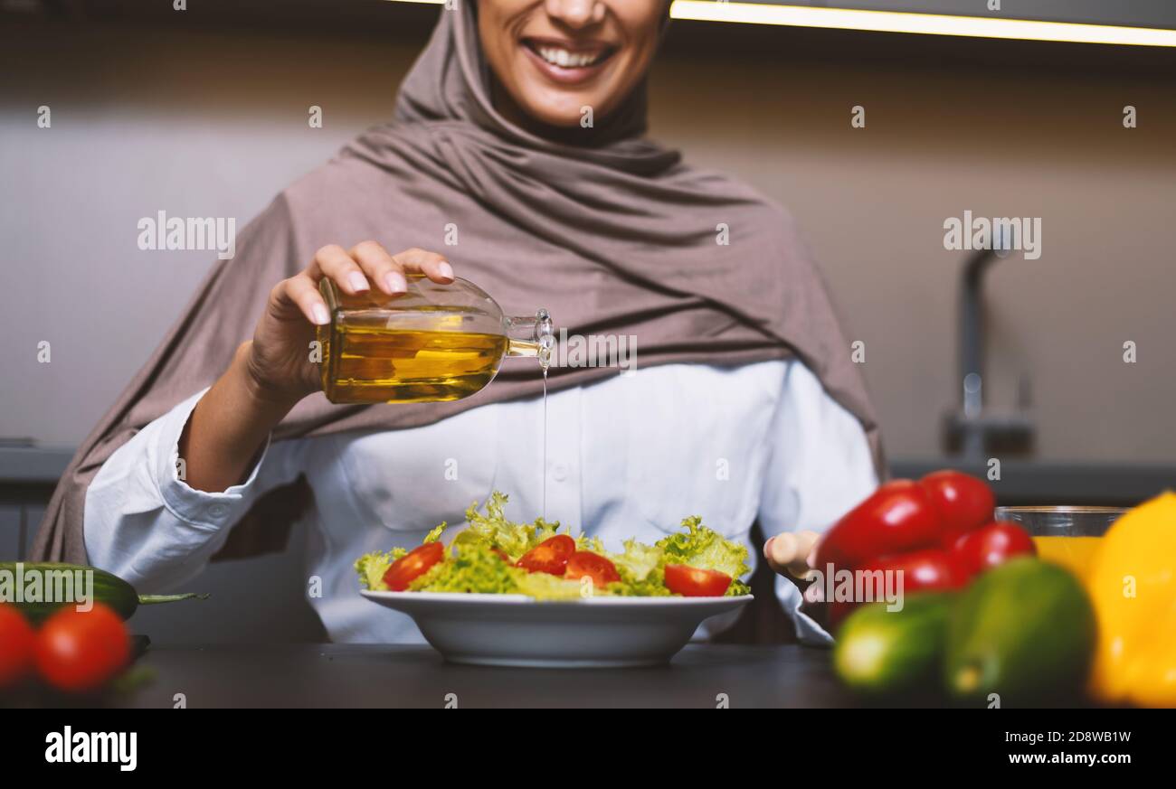 Muslim Woman Cooking In Kitchen Making Salad At Home, Cropped Stock ...