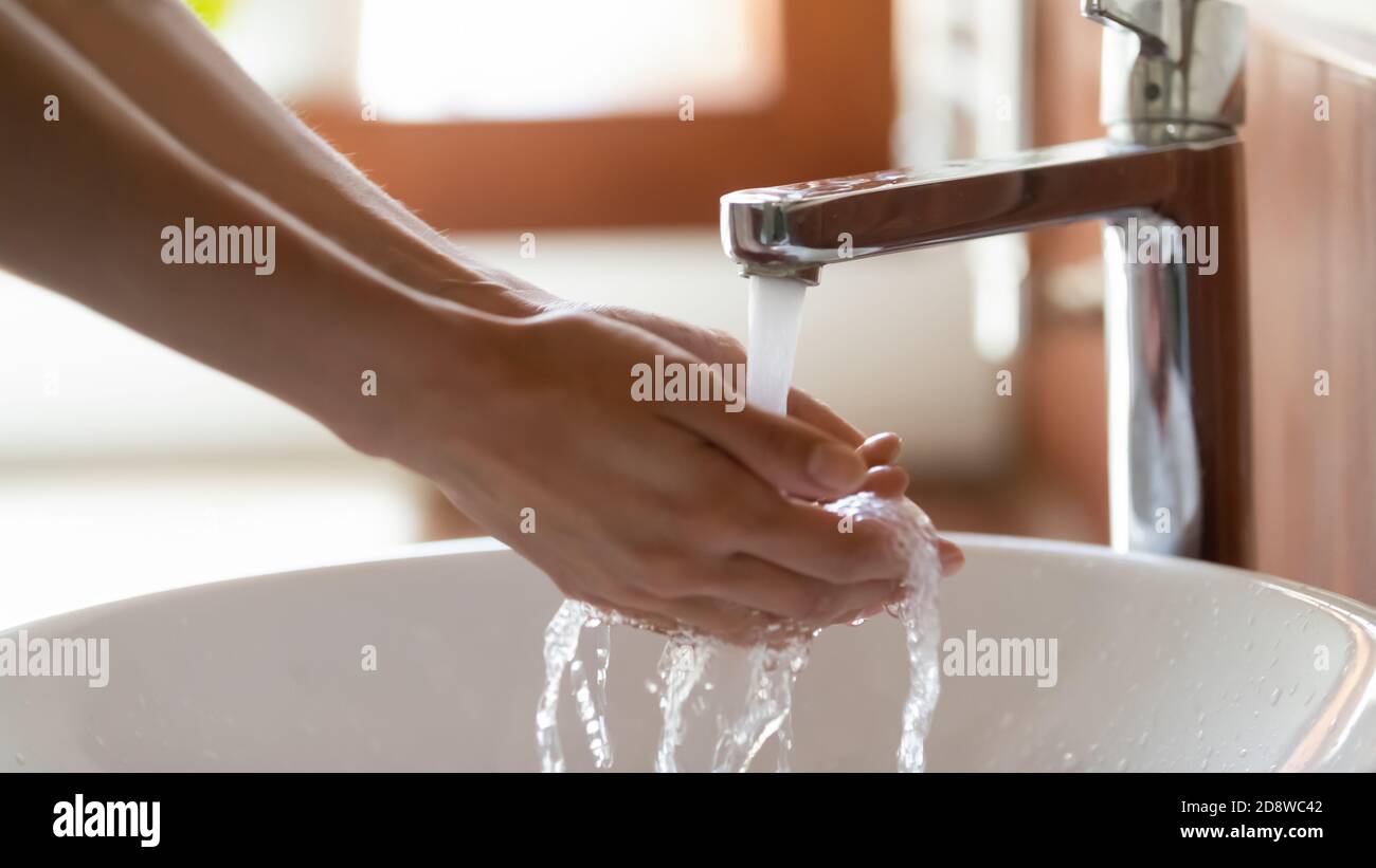 Woman washing hands toilet hi-res stock photography and images - Alamy