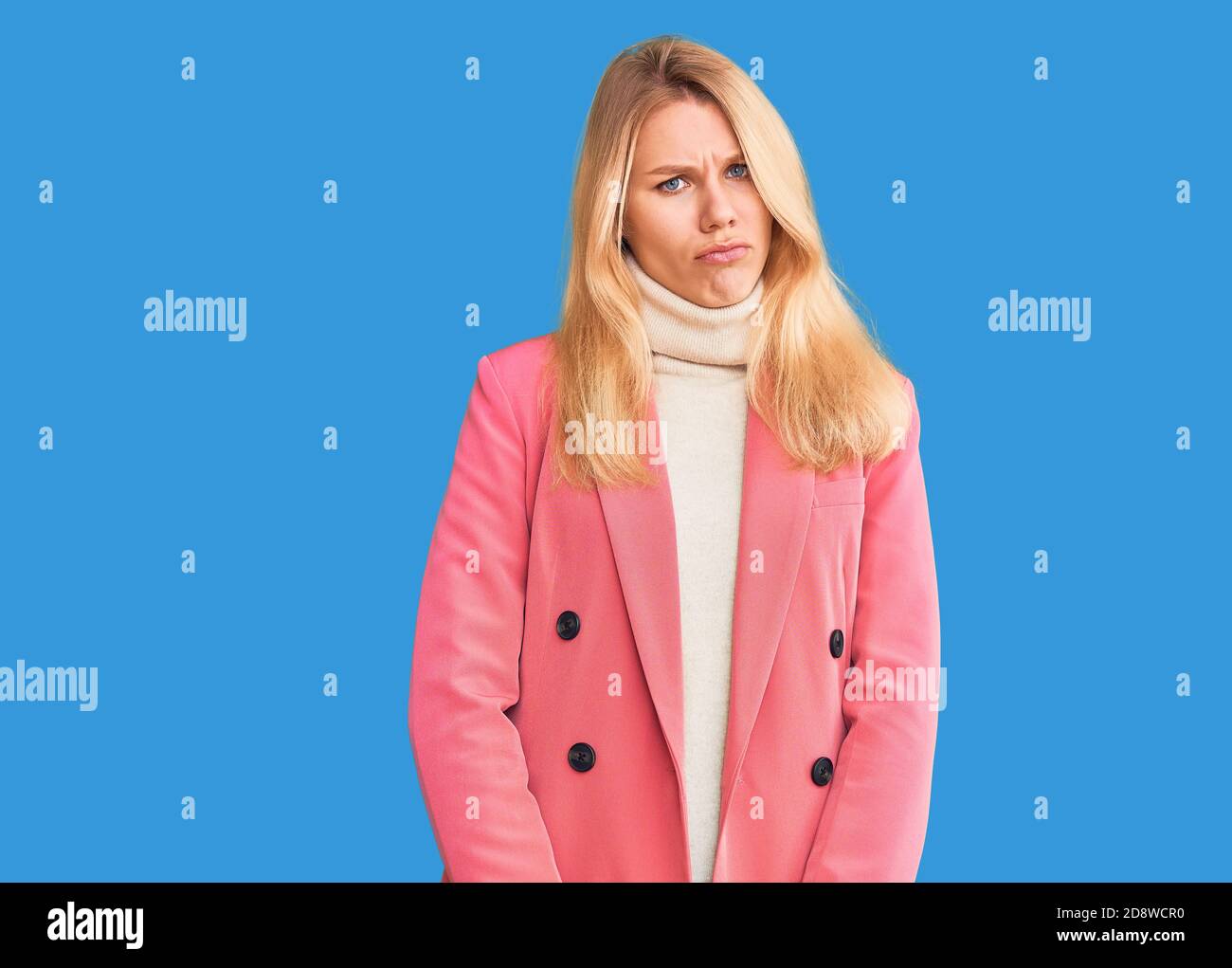 Young beautiful blonde woman wearing elegant clothes depressed and ...