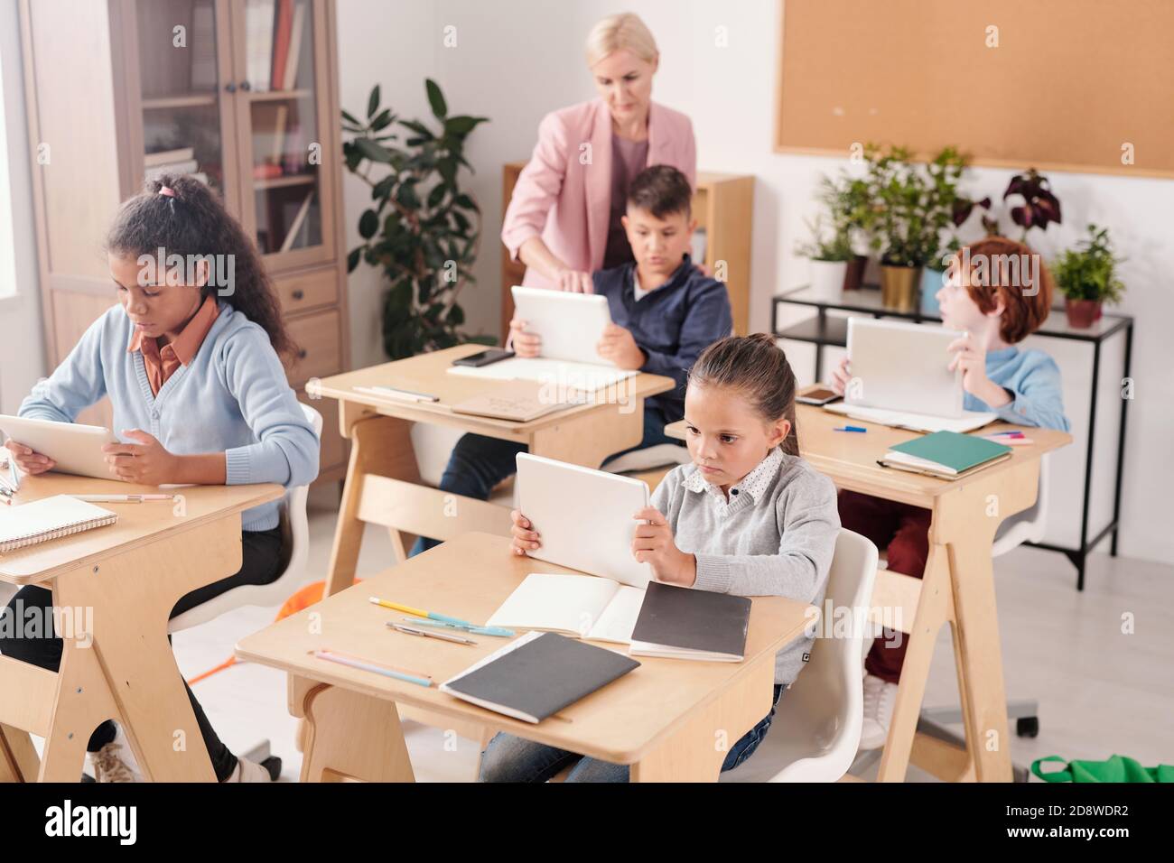 Child student laptop classroom desk hi-res stock photography and images ...