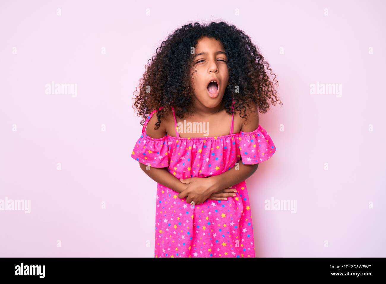 African american child with curly hair wearing casual dress with hand ...