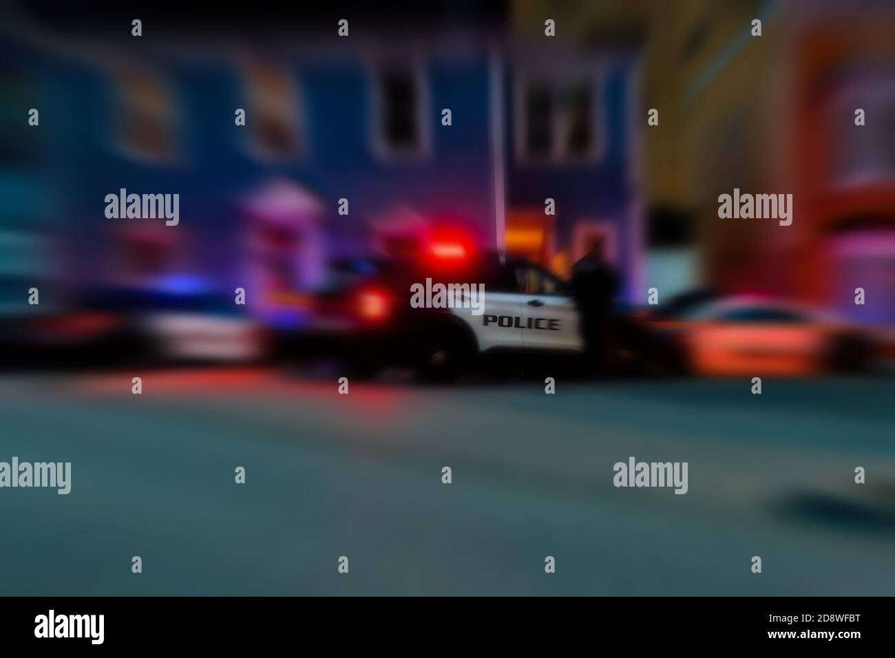 radial blur of police cars at night. Lights on top are illuminated ...