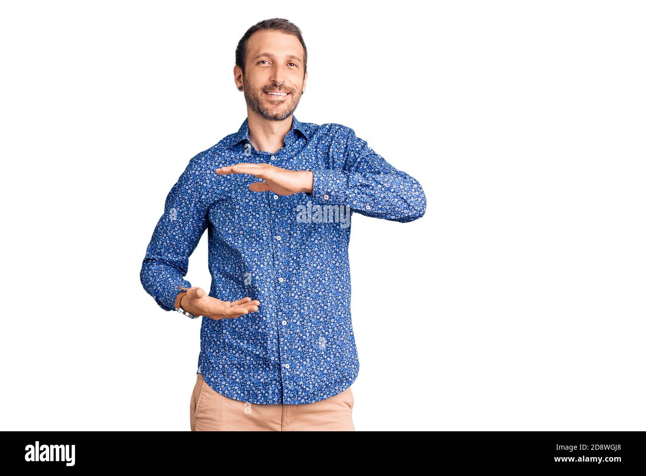 Young handsome man wearing casual clothes gesturing with hands showing ...