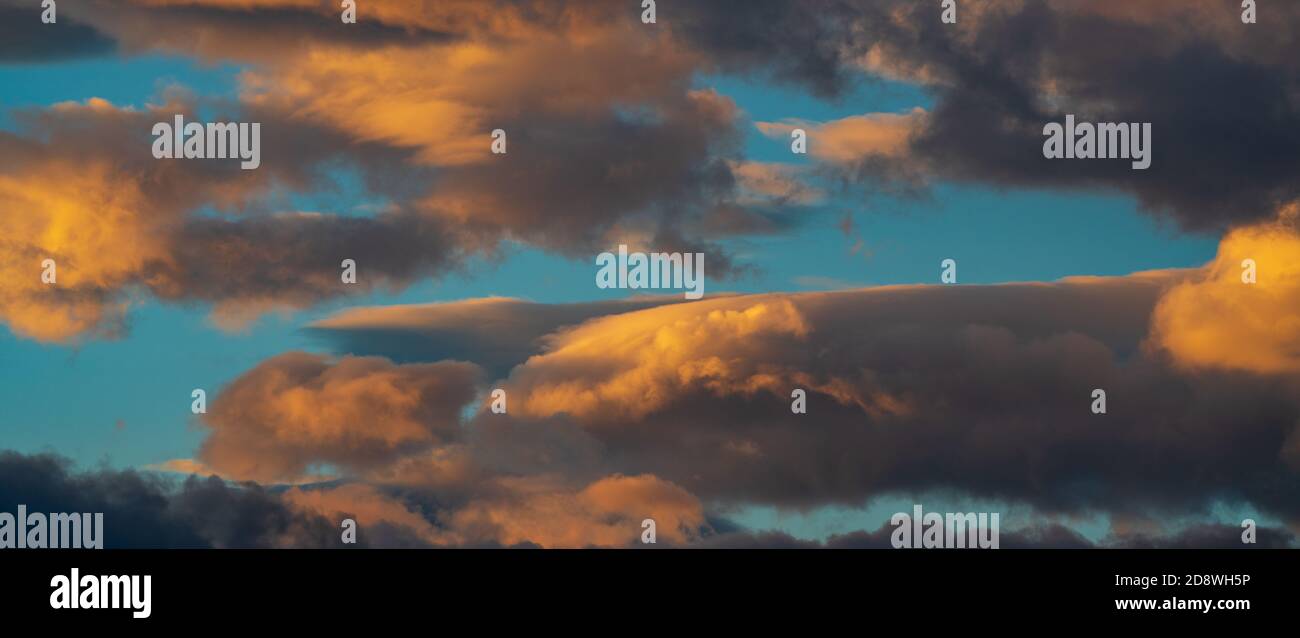 Panoramic view of dramatic colorful thunderclouds rising of sun ...