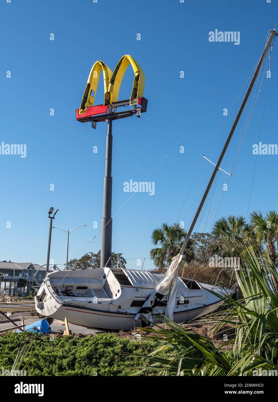 Hurricane Zeta wind damage and storm surge debris including a sailboat ...