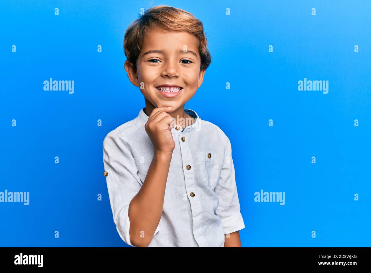 Adorable latin kid wearing casual clothes smiling looking confident at ...