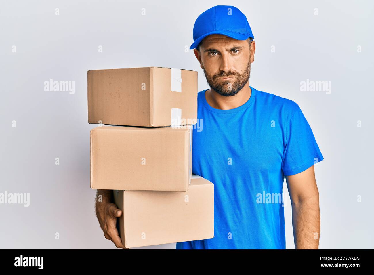 Handsome Man With Beard Wearing Courier Uniform Holding Delivery