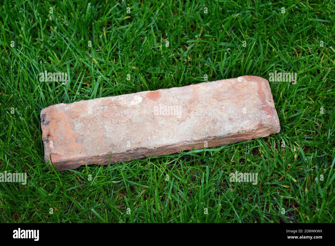 Cut red bricks range prepared to use design in the wall Stock Photo - Alamy