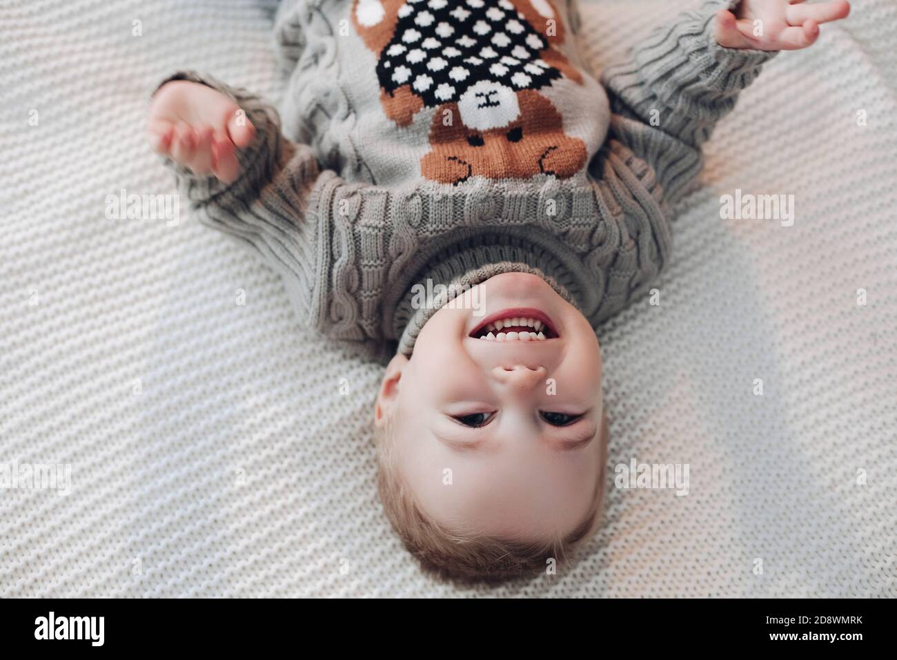 Cute little kid smiling and looking at camera Stock Photo - Alamy