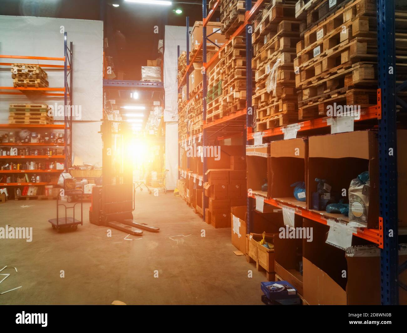 Hangar warehouse with rows of shelves with cargo Stock Photo - Alamy