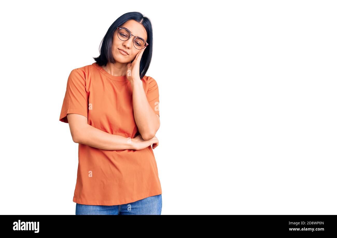 Young beautiful latin woman wearing casual clothes thinking looking ...