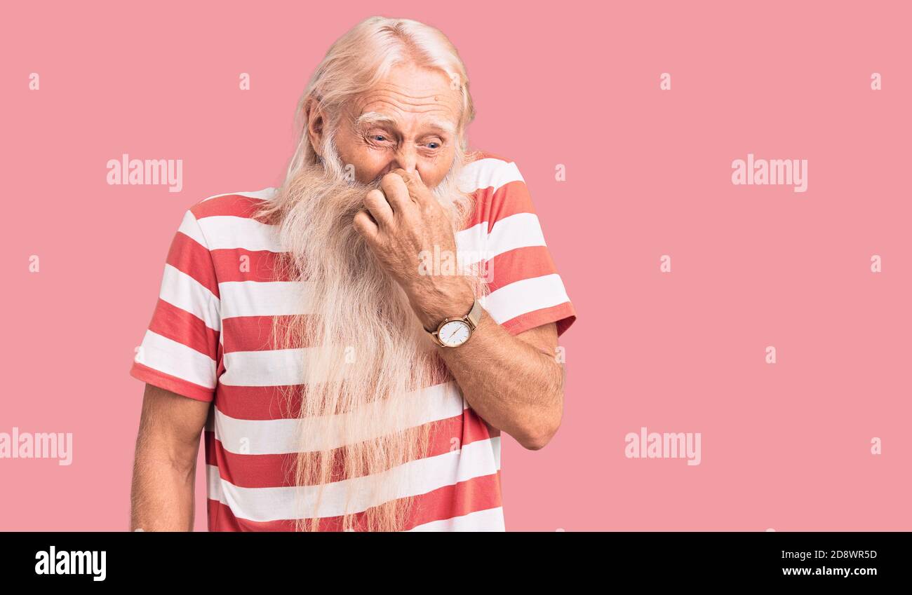 Old senior man with grey hair and long beard wearing striped tshirt ...