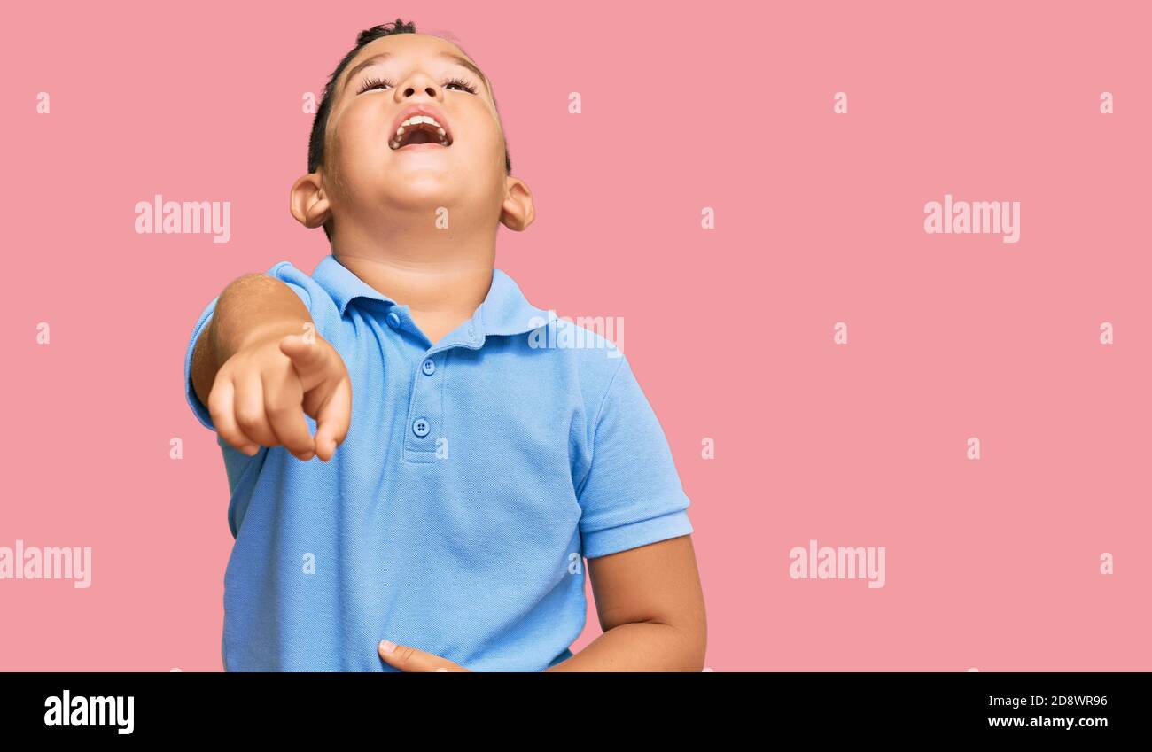 Little boy hispanic kid wearing casual clothes laughing at you ...
