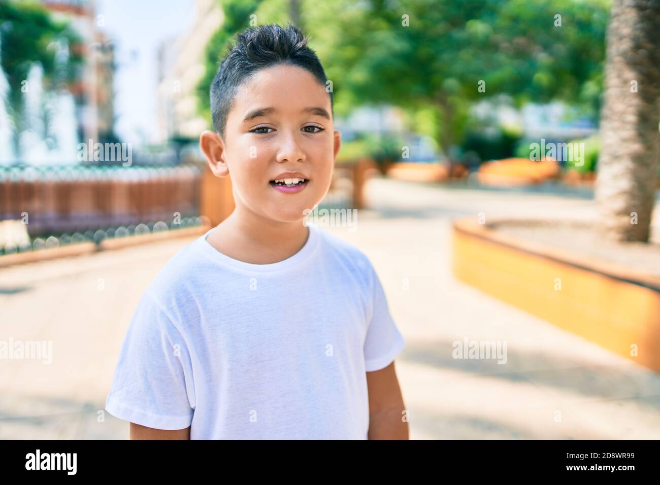 Adorable boy smiling happy standing at street of city Stock Photo - Alamy