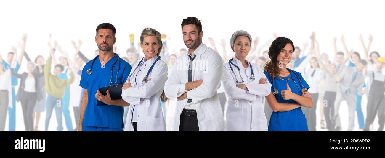 Team of three doctors standing in front of crowd of many people ...