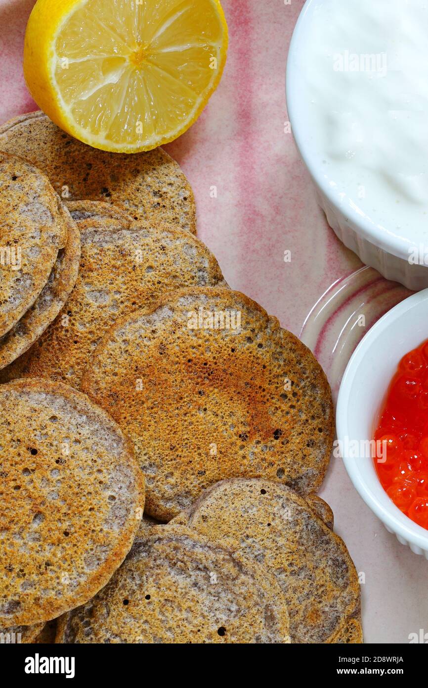 Platter of fresh buckwheat blini pancakes Stock Photo - Alamy