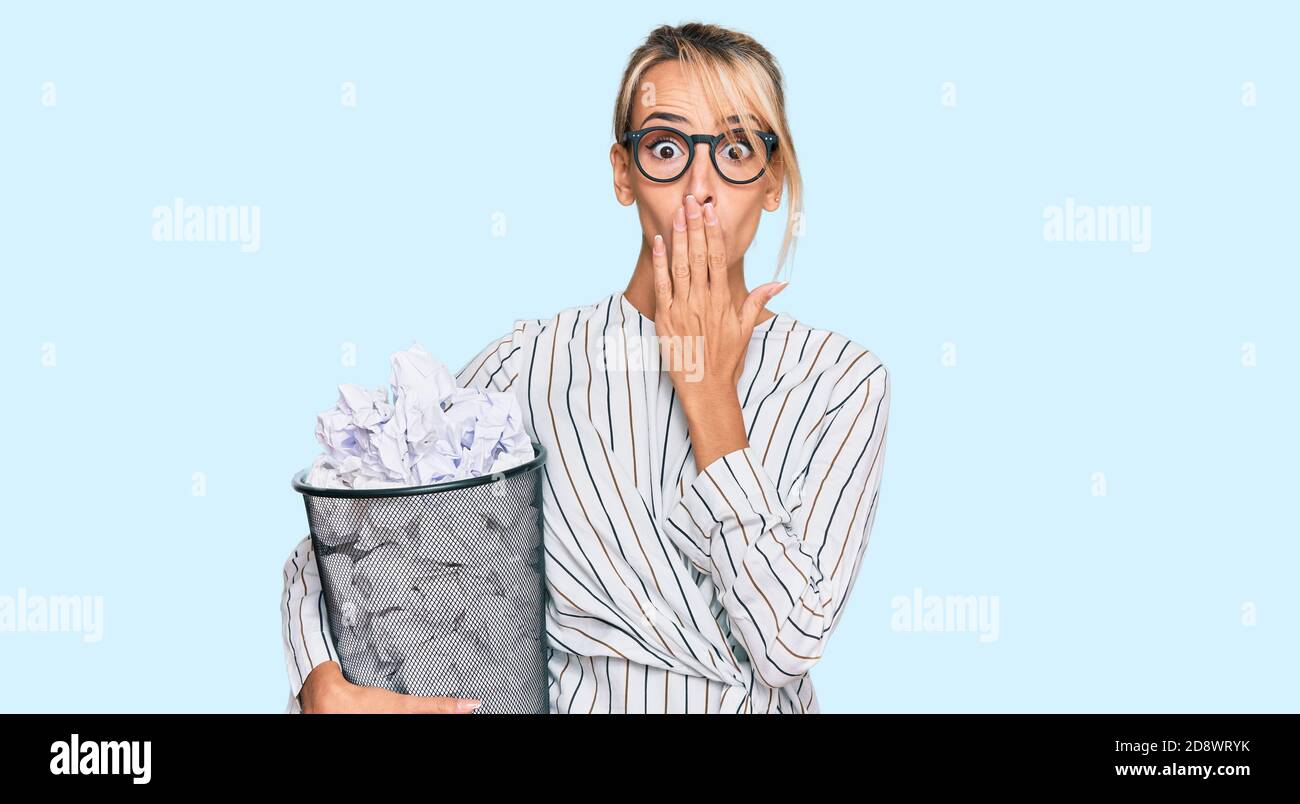 Woman holding papers shocked hi-res stock photography and images - Alamy