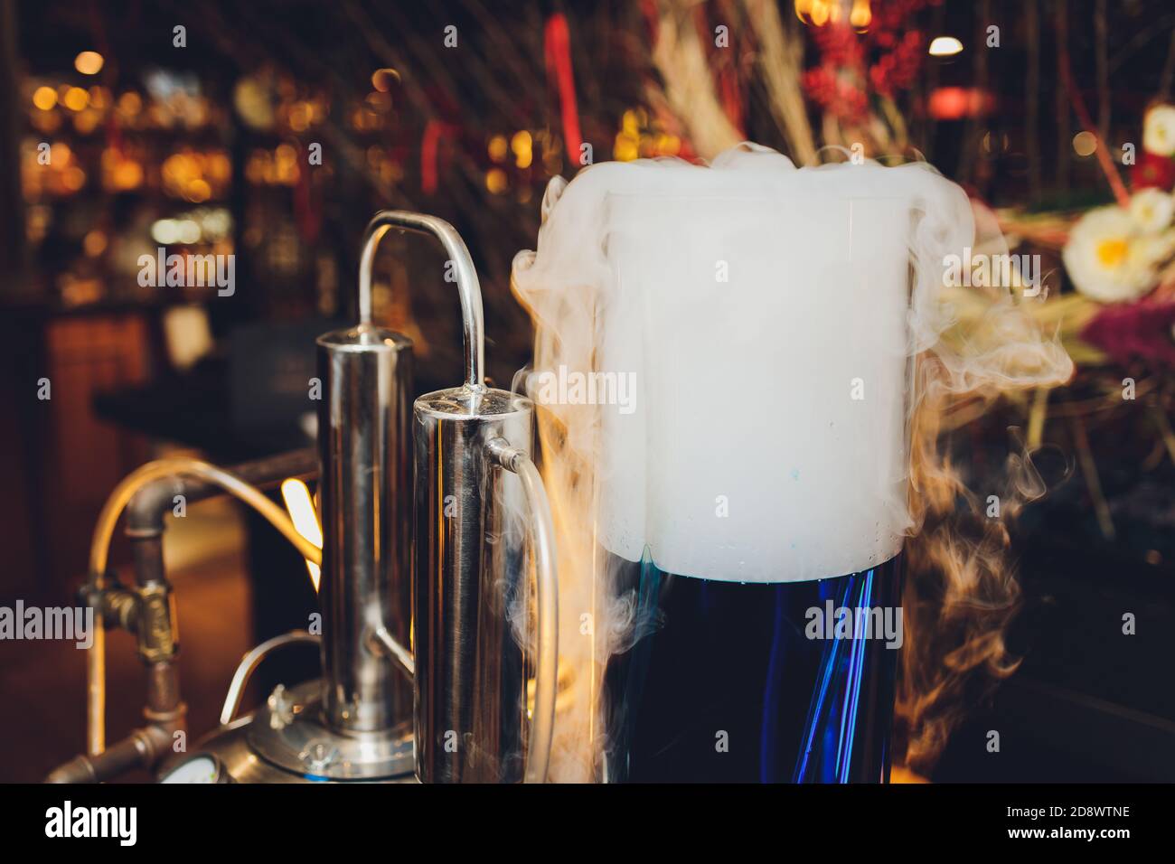 Test tubes with multi-colored liquid. Alcohol in test tubes dark bar ...