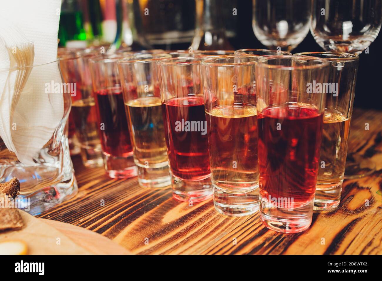 Test tubes with multi-colored liquid. Alcohol in test tubes dark bar ...