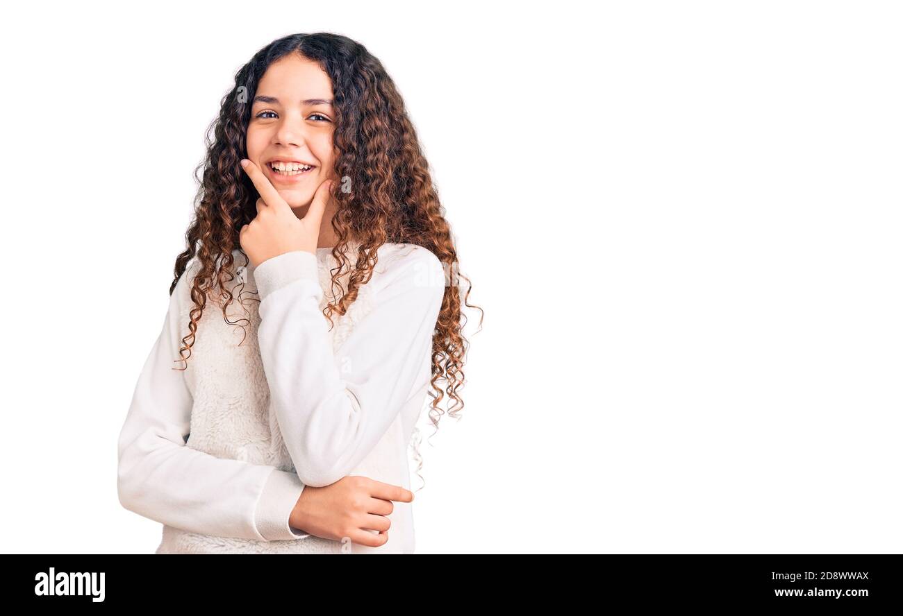 Beautiful kid girl with curly hair wearing casual clothes looking ...