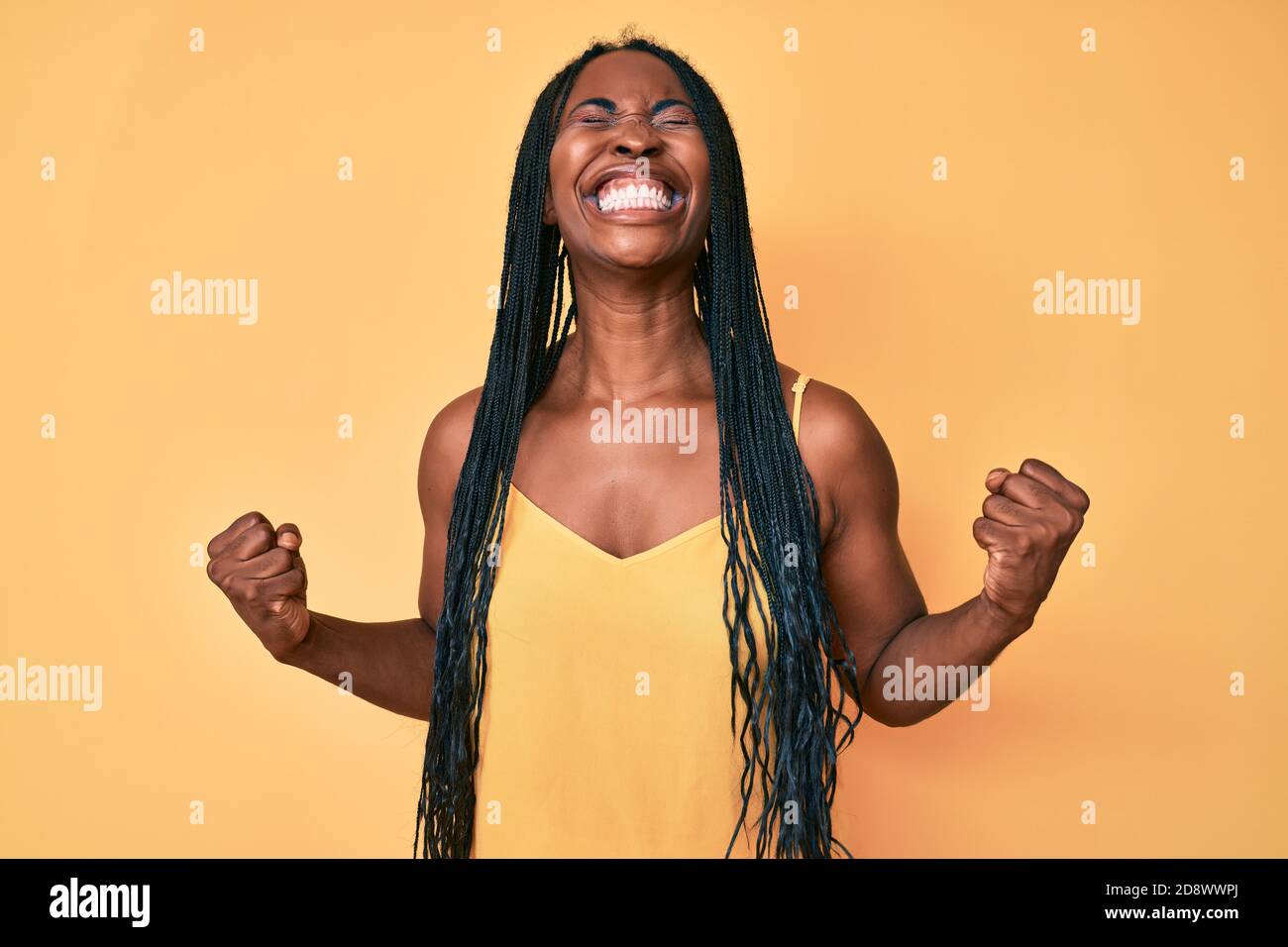 African american woman with braids wearing casual clothes very happy ...