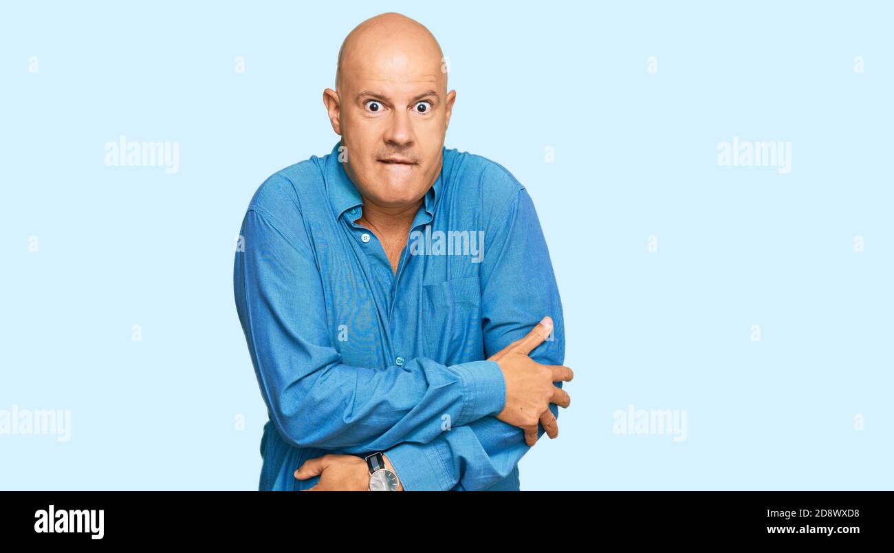 Middle age bald man wearing casual clothes shaking and freezing for ...