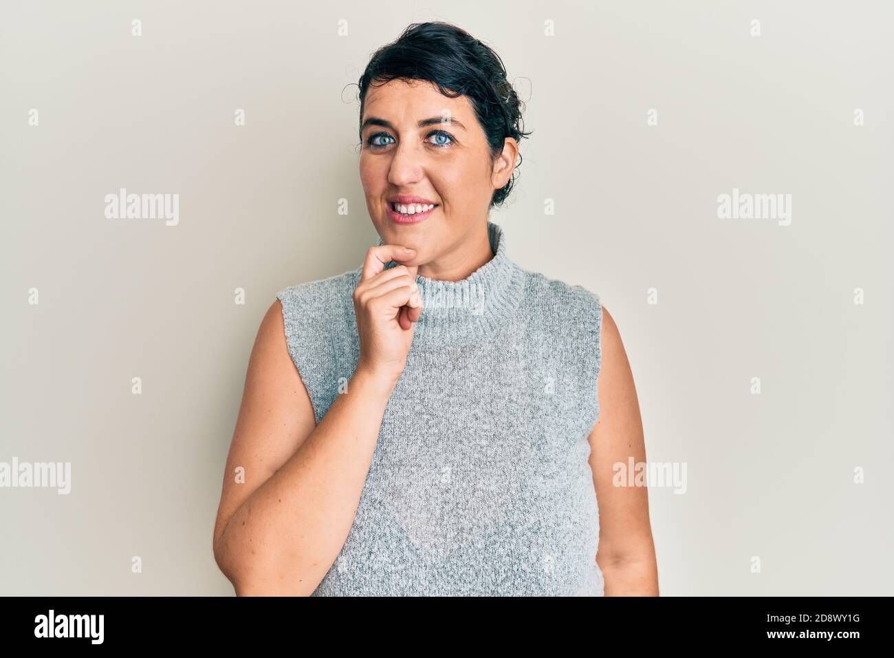 Plus size brunette woman wearing casual clothes smiling looking ...